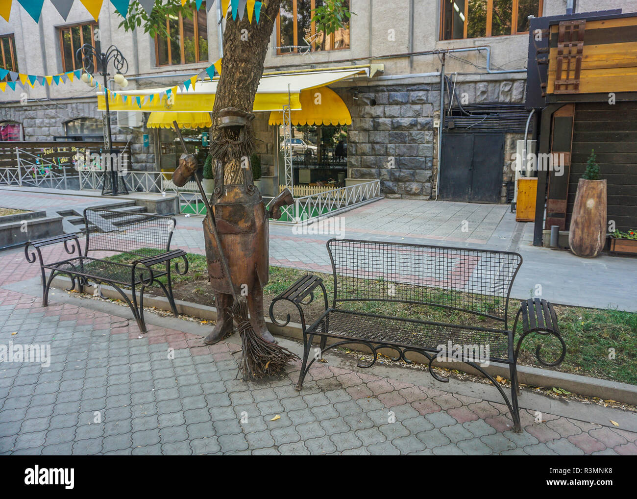 Yerevan Street Art Man with a Broom Cleaning the Street Stock Photo - Alamy
