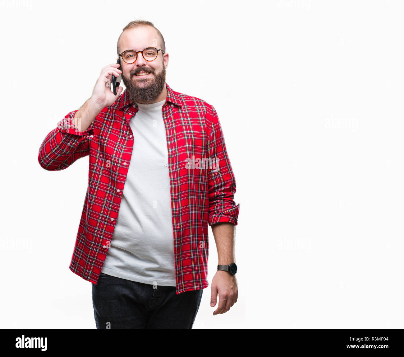 Young caucasian hipster man talking on smartphone over isolated ...