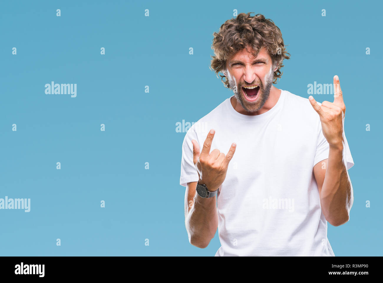 Handsome hispanic model man over isolated background shouting with ...