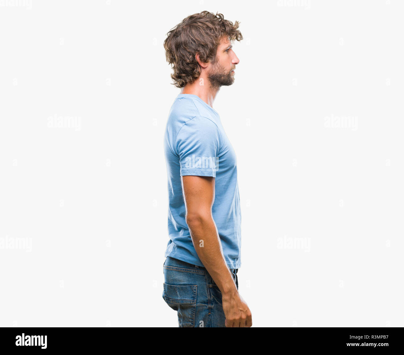 Handsome hispanic model man over isolated background looking to side ...