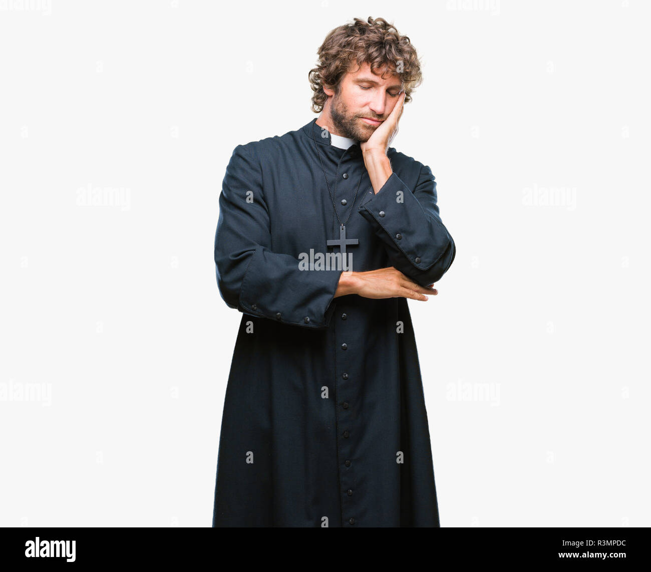 Handsome hispanic catholic priest man over isolated background thinking ...