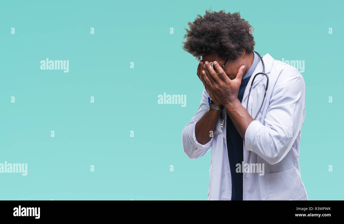 Afro american doctor man over isolated background with sad expression ...