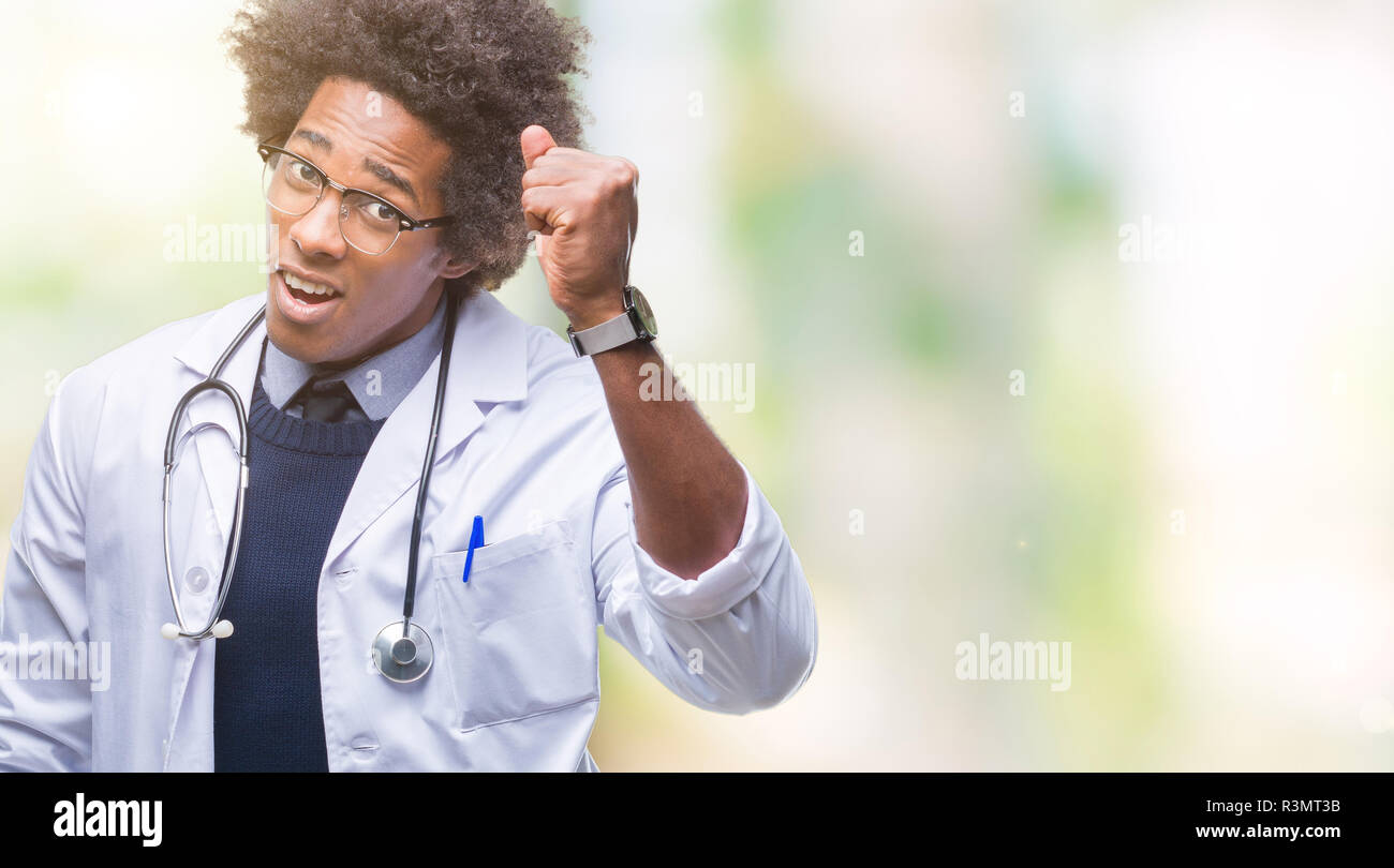 Afro american doctor man over isolated background angry and mad raising ...
