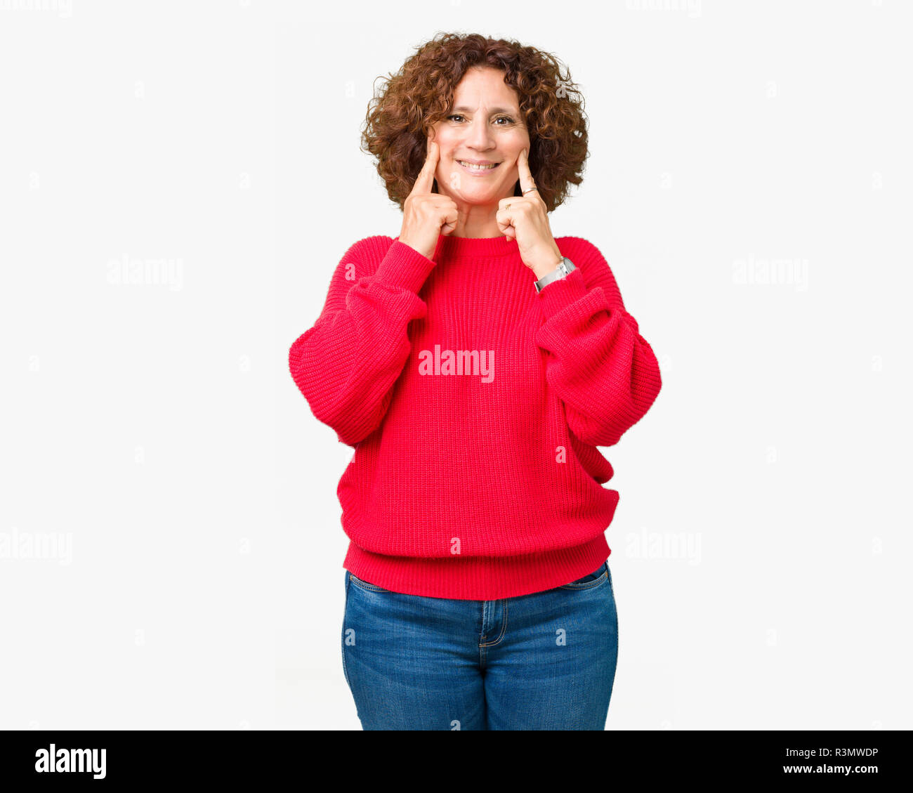 Beautiful middle ager senior woman red winter sweater over isolated ...