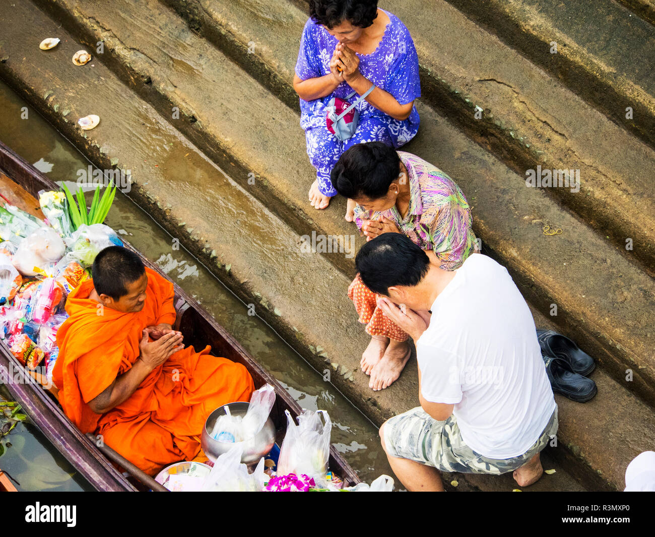 Thailand, Bangkok, Monk getting Alms at Floating Market in Damnoen ...