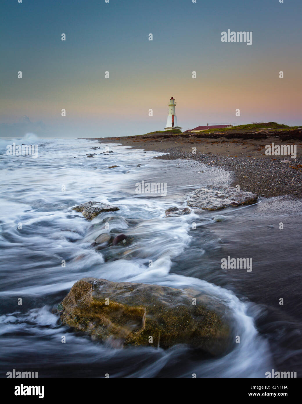 Lighthouse at Sunrise Stock Photo - Alamy