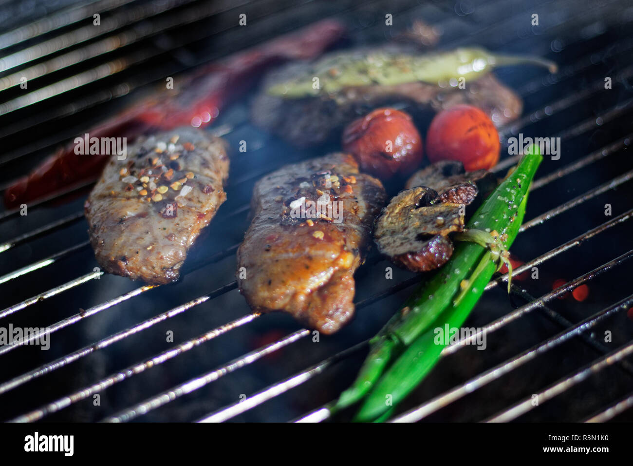 juicy wild hog with vegetables on a charcoal grill barbecue Stock Photo ...
