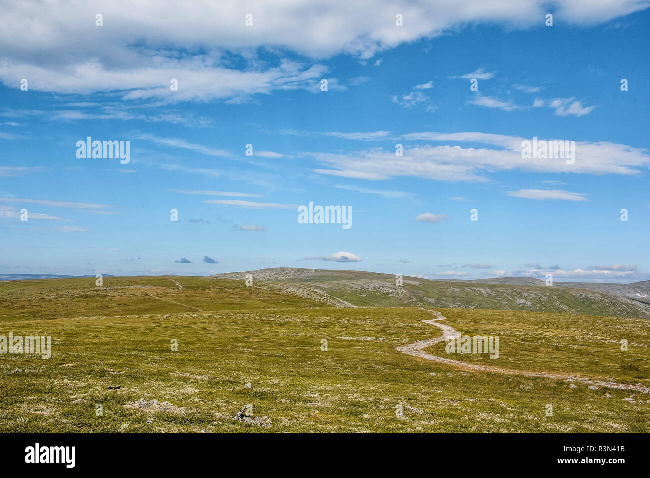 Spectacular mountain landscape. Outdoor activities. Blue sky and trail ...