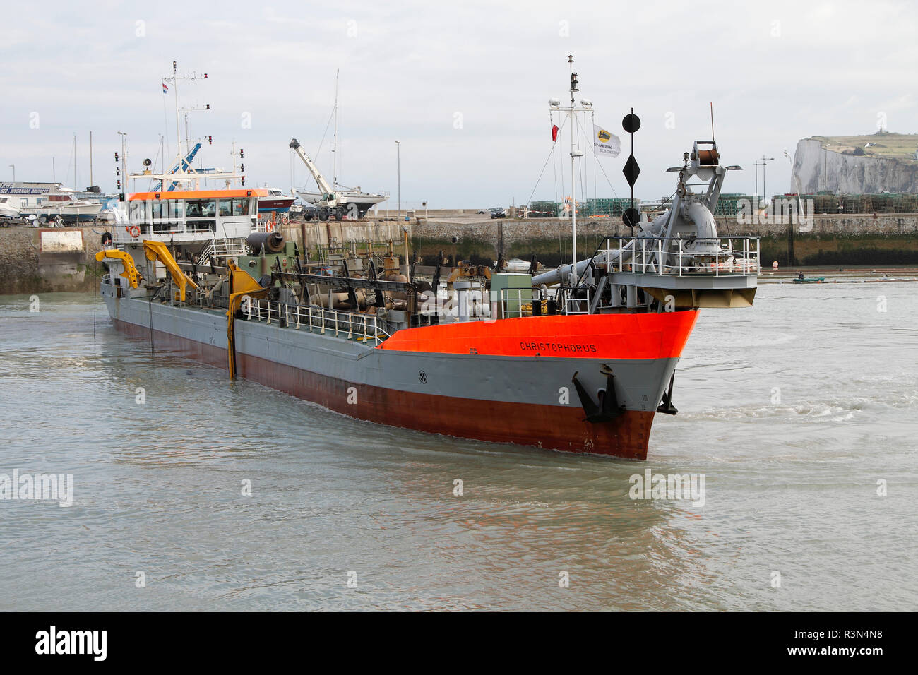 Dredge maneuvering in the port of Treport, Normandy, France Stock Photo ...