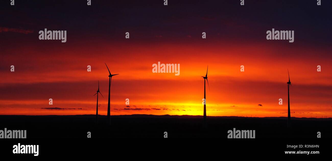 wind turbine sunrise Stock Photo - Alamy