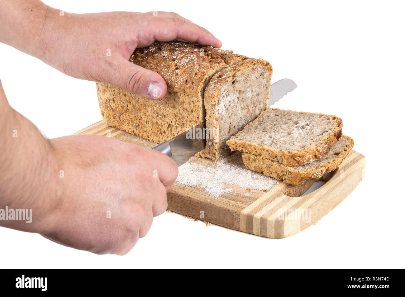 hand cutting wholemeal bread Stock Photo - Alamy