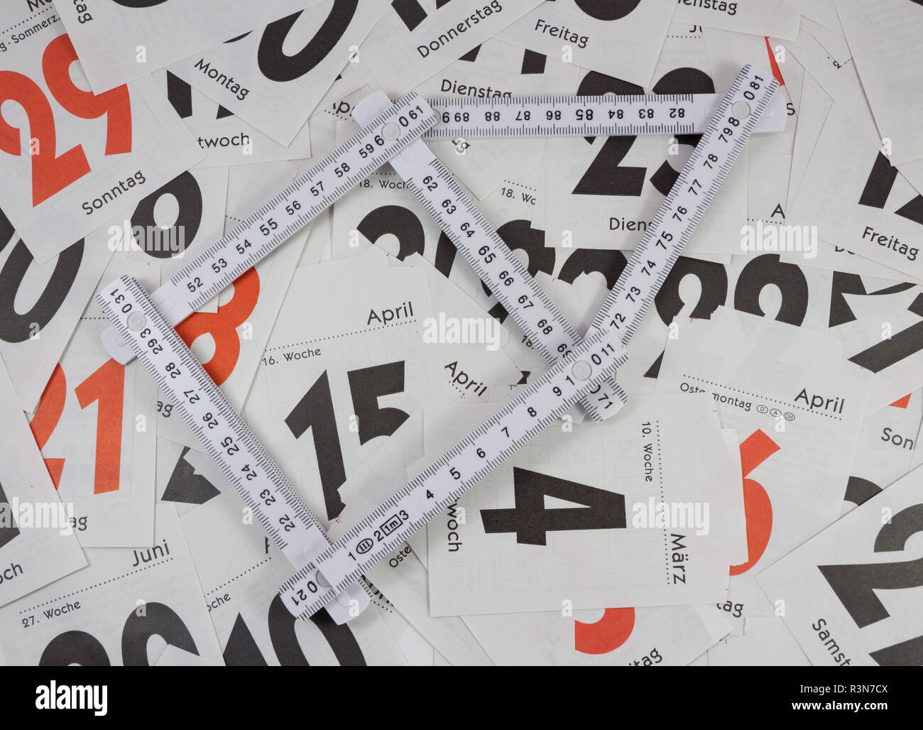 meter scale in house form on calendar pages Stock Photo - Alamy