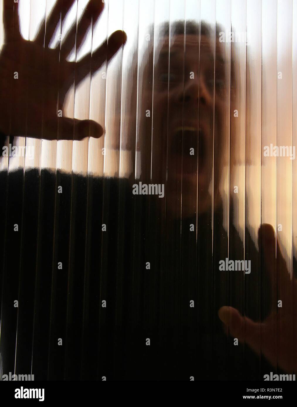 aggressive man behind a disc - horrorbild Stock Photo - Alamy