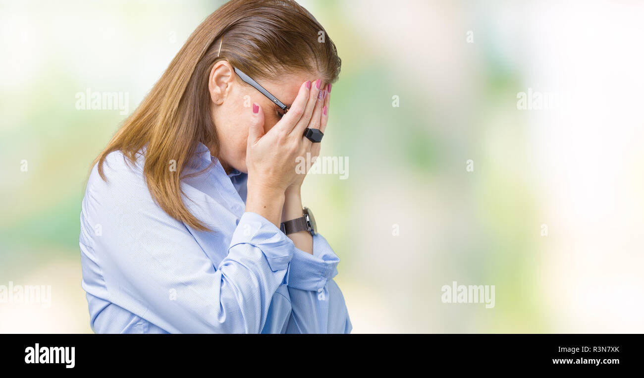 Beautiful middle age mature business woman wearing glasses over ...
