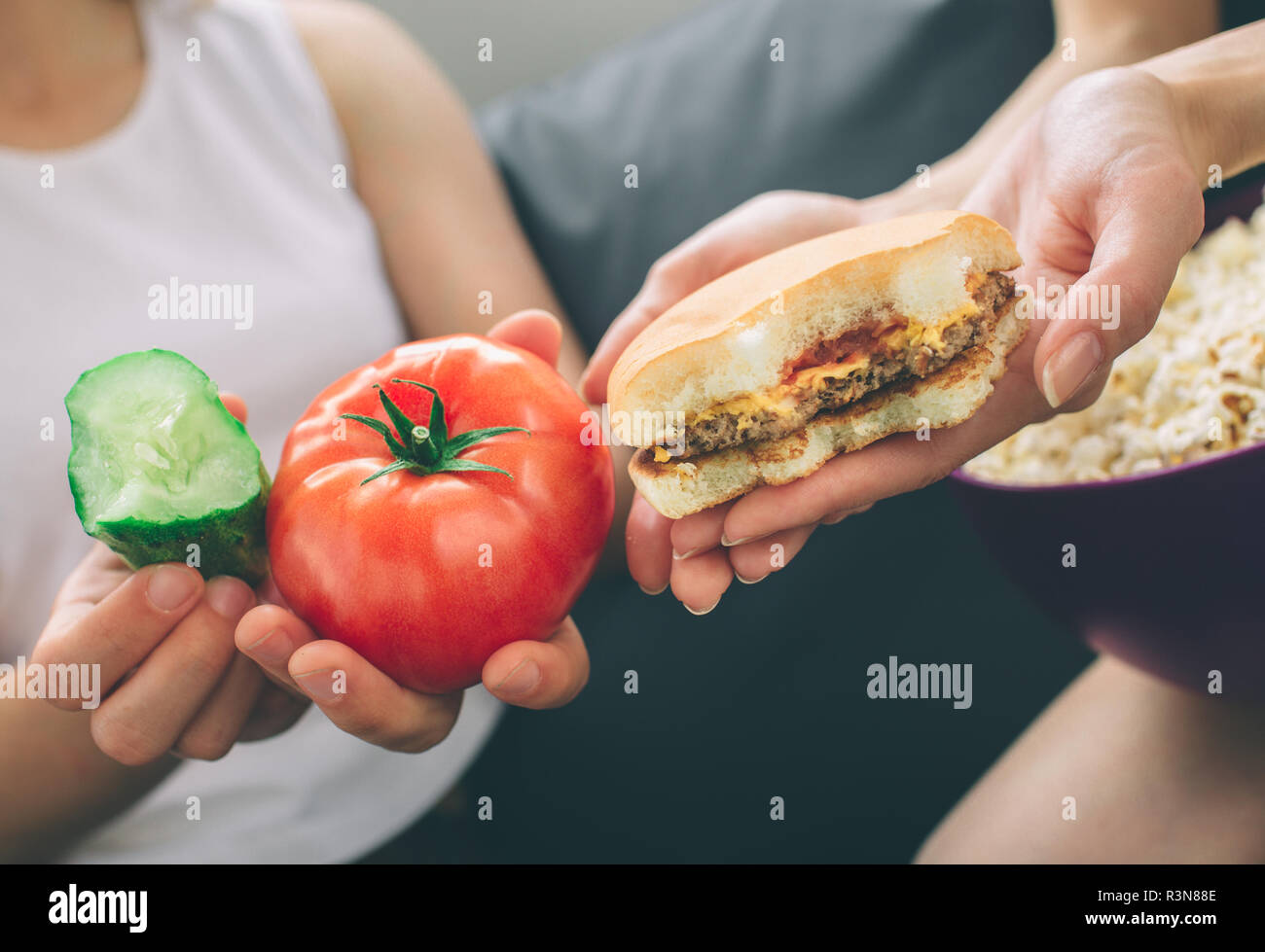 healthy food VS fast food Stock Photo - Alamy