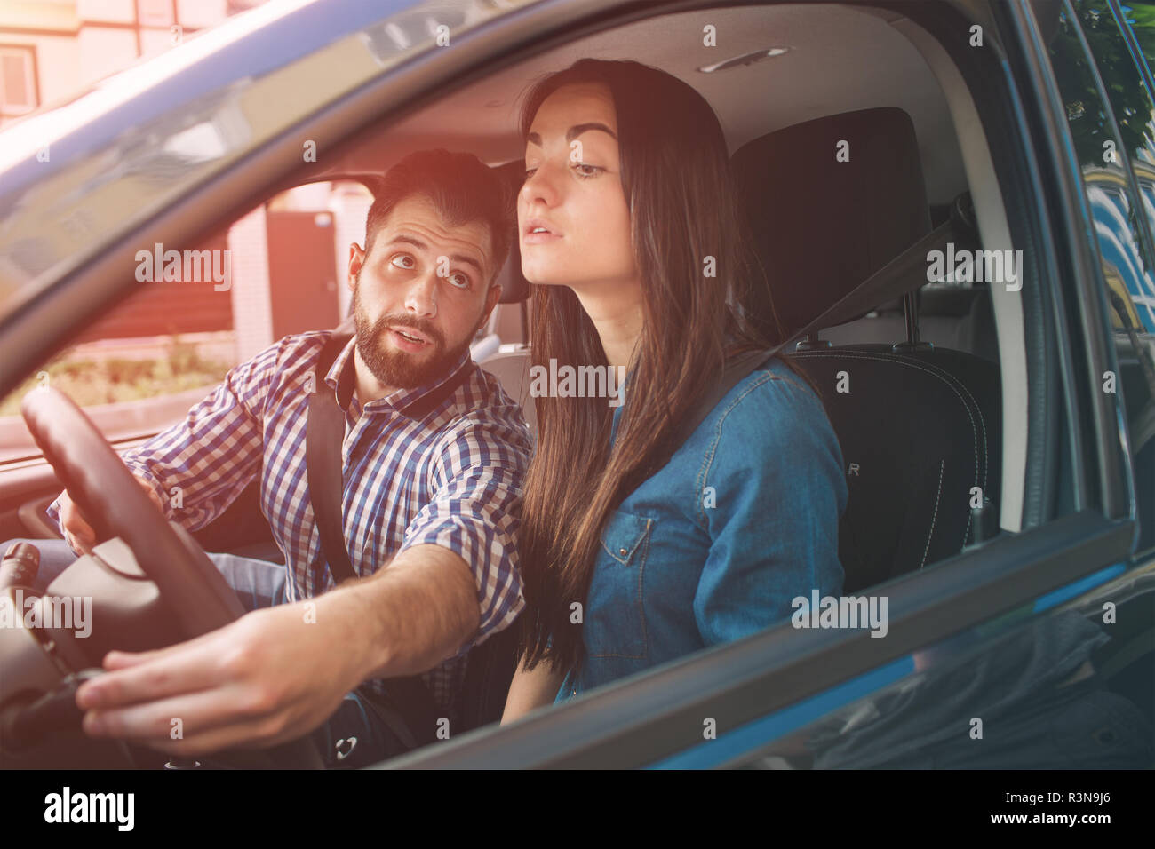 Driving test. Young serious woman driving car feeling inexperienced ...