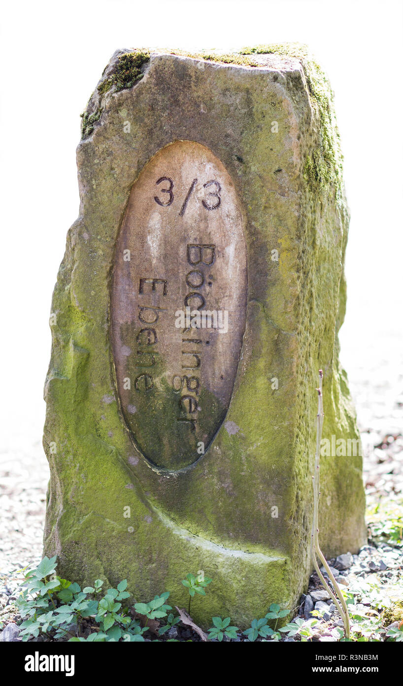 old boundary stone in white background Stock Photo - Alamy
