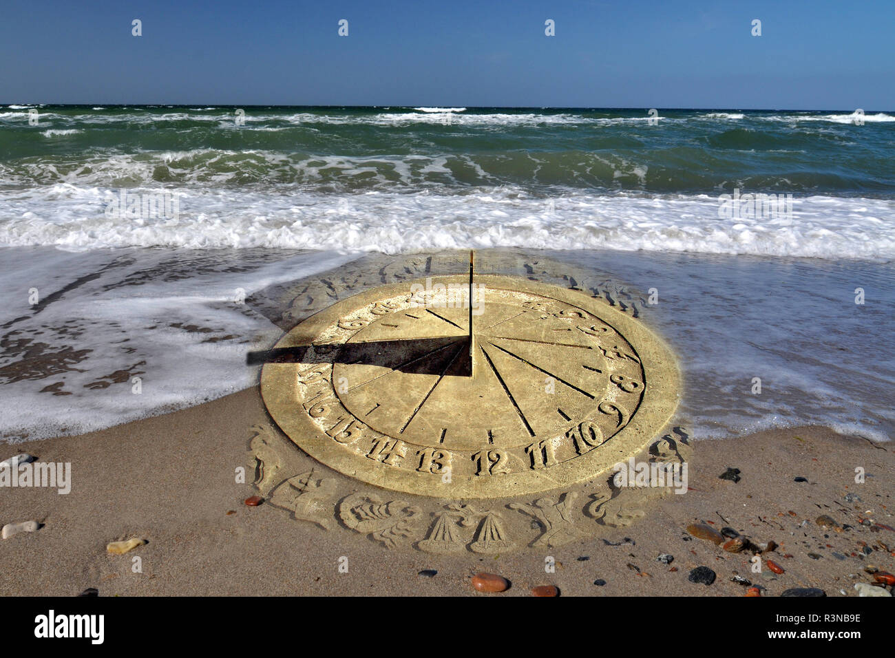 sundial on the beach Stock Photo - Alamy
