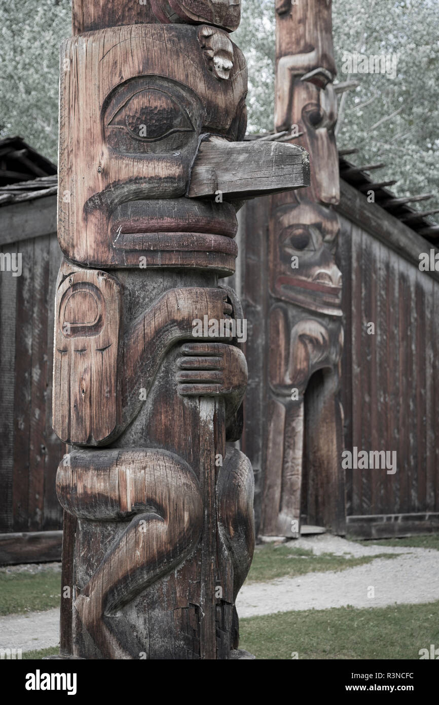 Canada, British Columbia, Hazelton. Totem poles and building at Ksan ...