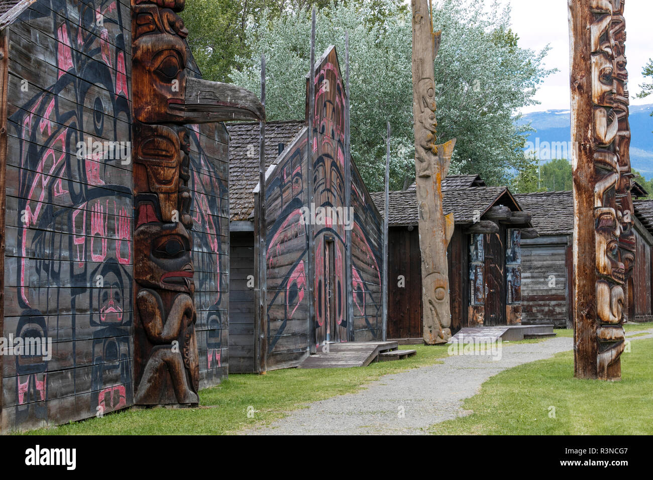 Canada, British Columbia, Hazelton. Totem poles and building at Ksan ...