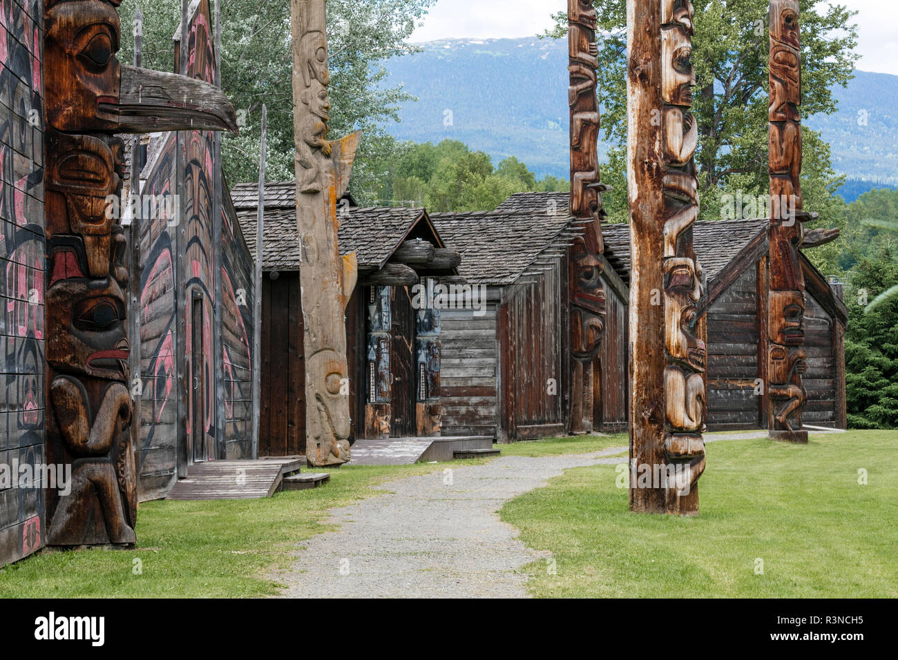 Canada, British Columbia, Hazelton. Totem poles and building at Ksan ...
