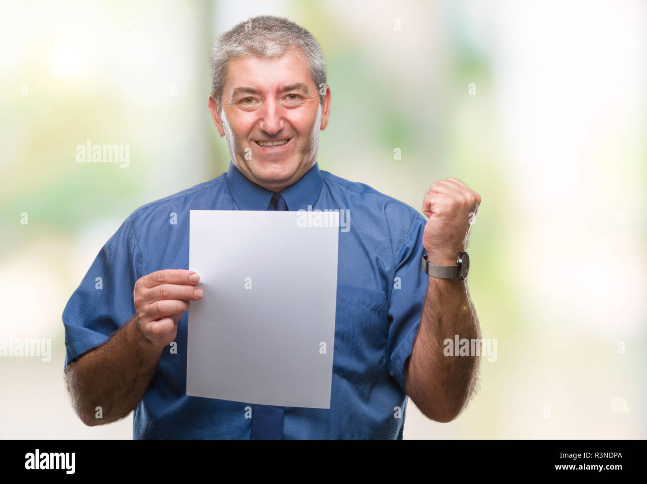 Handsome senior man holding blank sheet paper over isolated background ...
