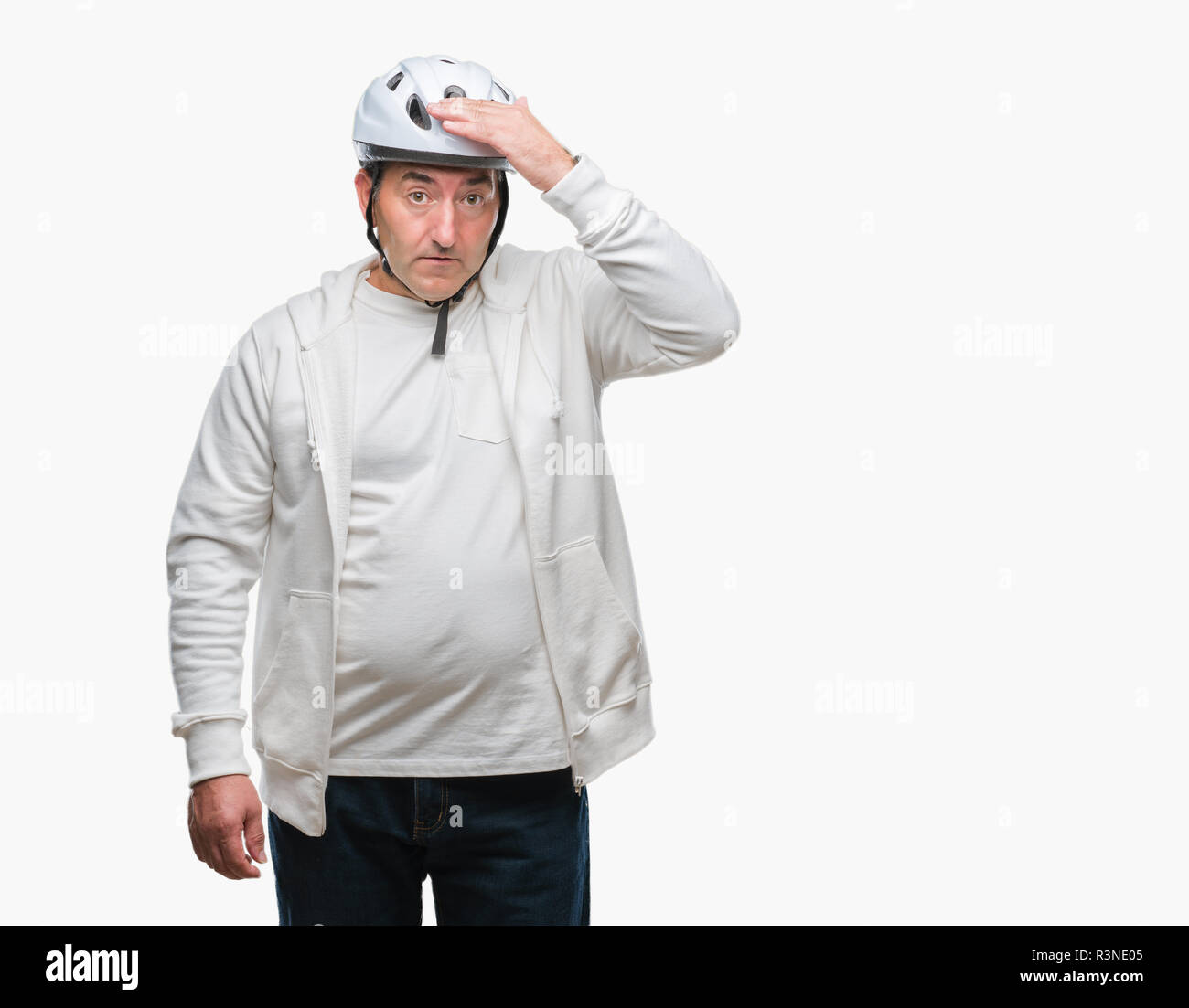 Handsome senior cyclist man wearing bike helmet over isolated ...