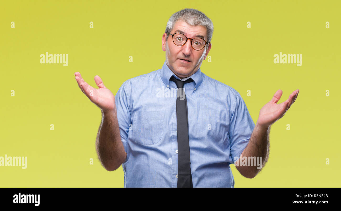 Handsome senior business man over isolated background clueless and ...
