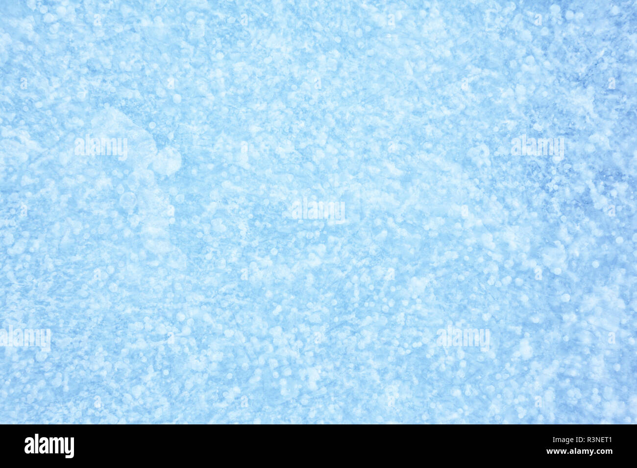 Surface of winter ice on Baikal lake in Siberia . Blue background of ...