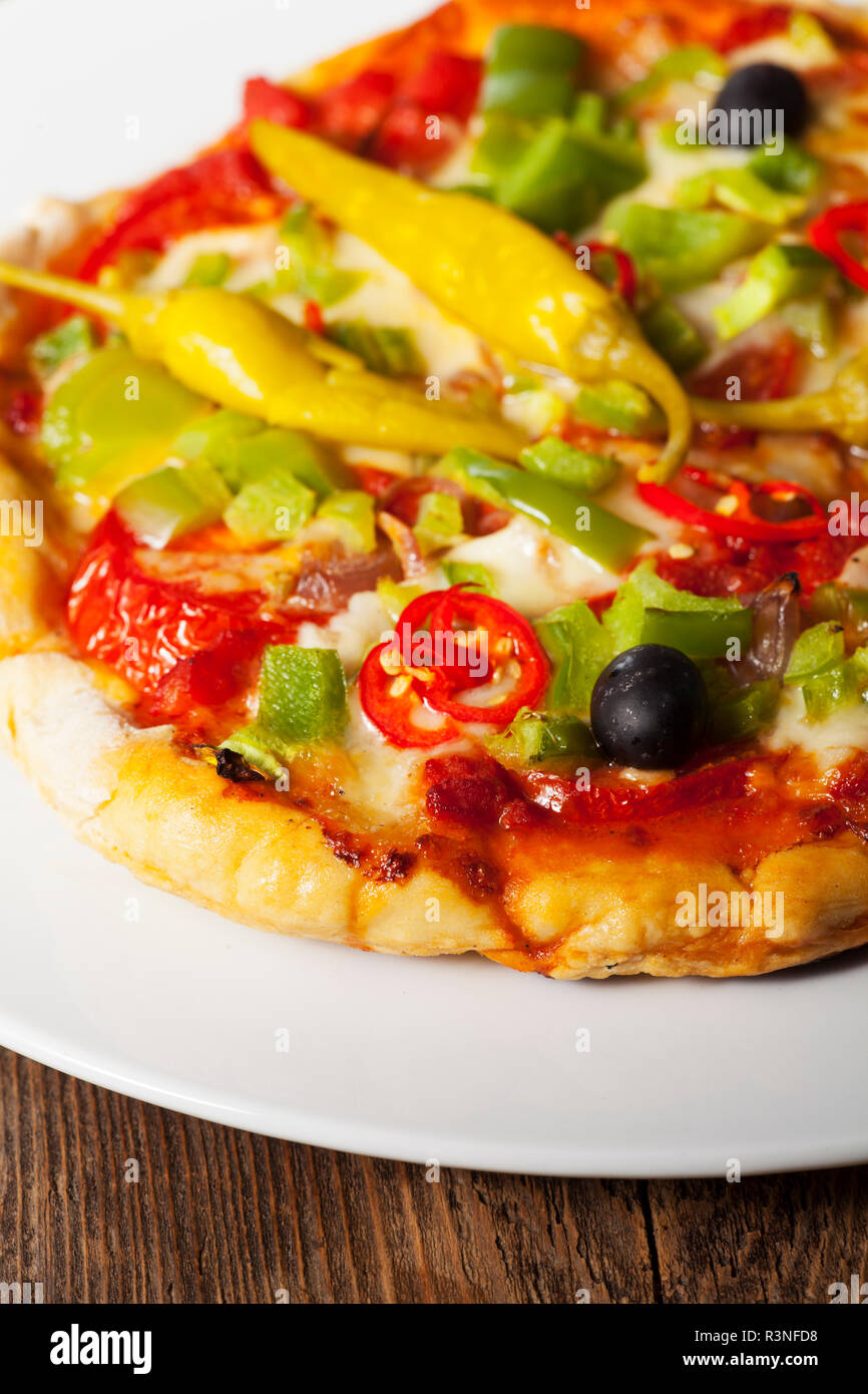 closeup of a pizza on a plate Stock Photo - Alamy