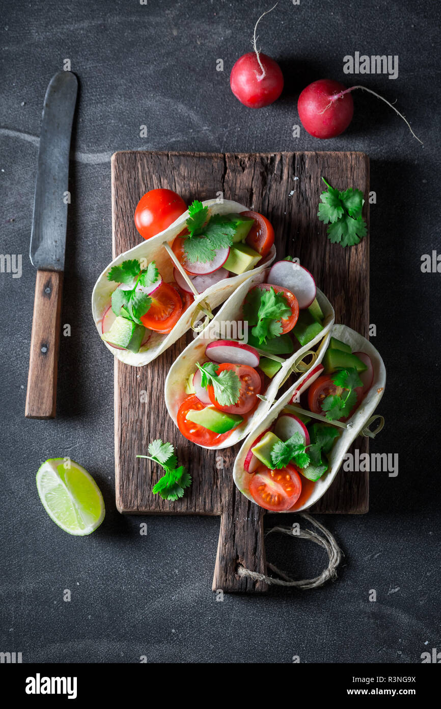 Top view of tacos with fresh vegetables and lime Stock Photo - Alamy