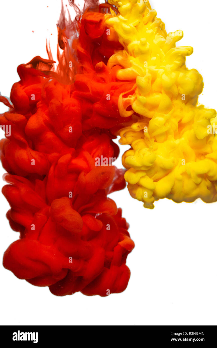 abstract formed by color dissolving in water over white background ...