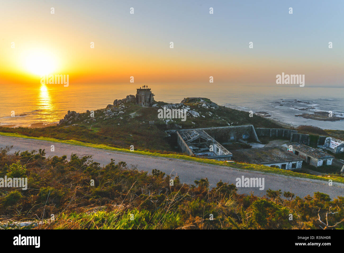 A sunset view of the abandoned remains of an old Spanish military base ...