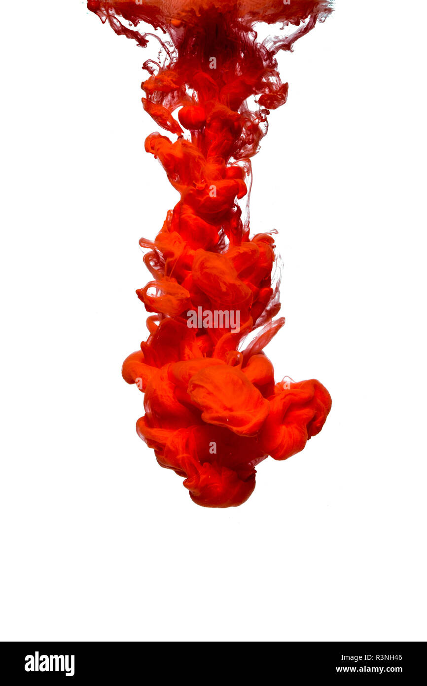 abstract formed by color dissolving in water over white background ...