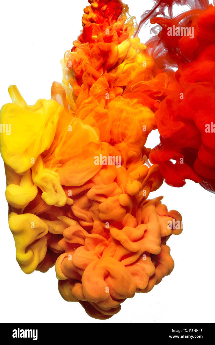 abstract formed by color dissolving in water over white background ...