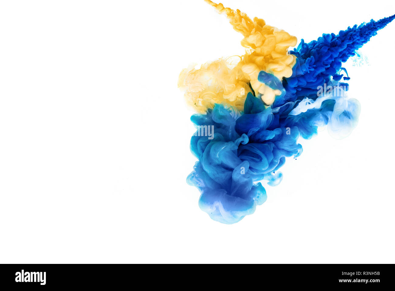 abstract formed by color dissolving in water over white background ...