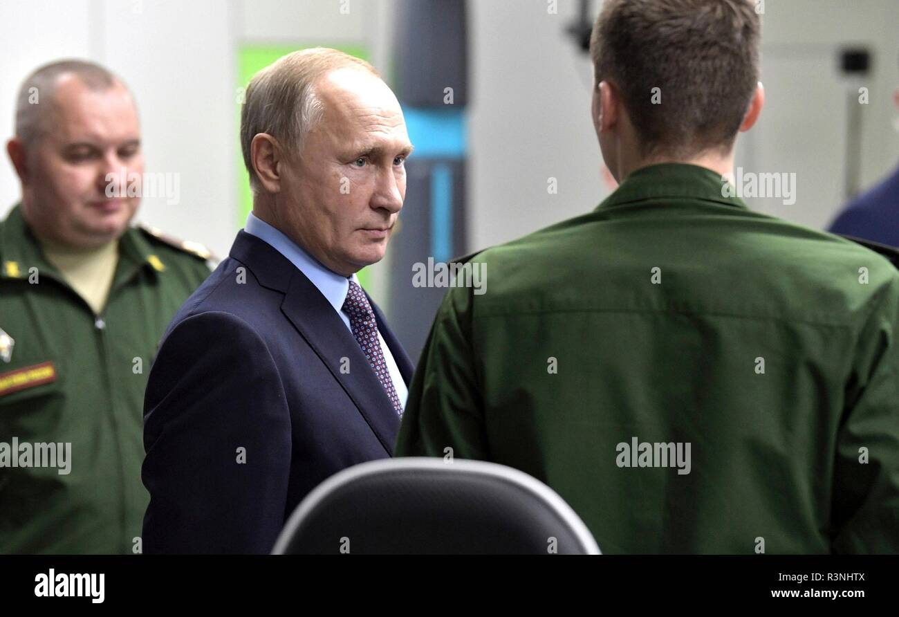 Russian President Vladimir Putin, center, tours the ERA Military ...