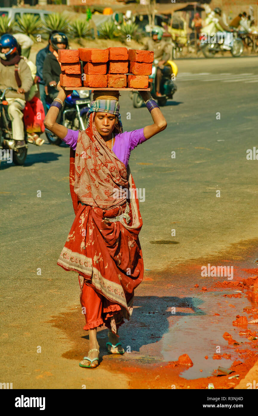 Construction worker carrying bricks hi-res stock photography and images ...