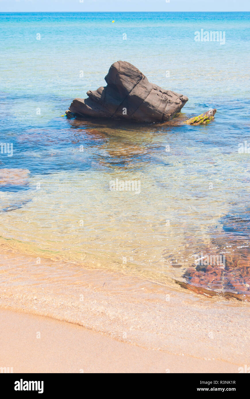 Rock surfacing from the crystalline sea with line of horizon Stock ...