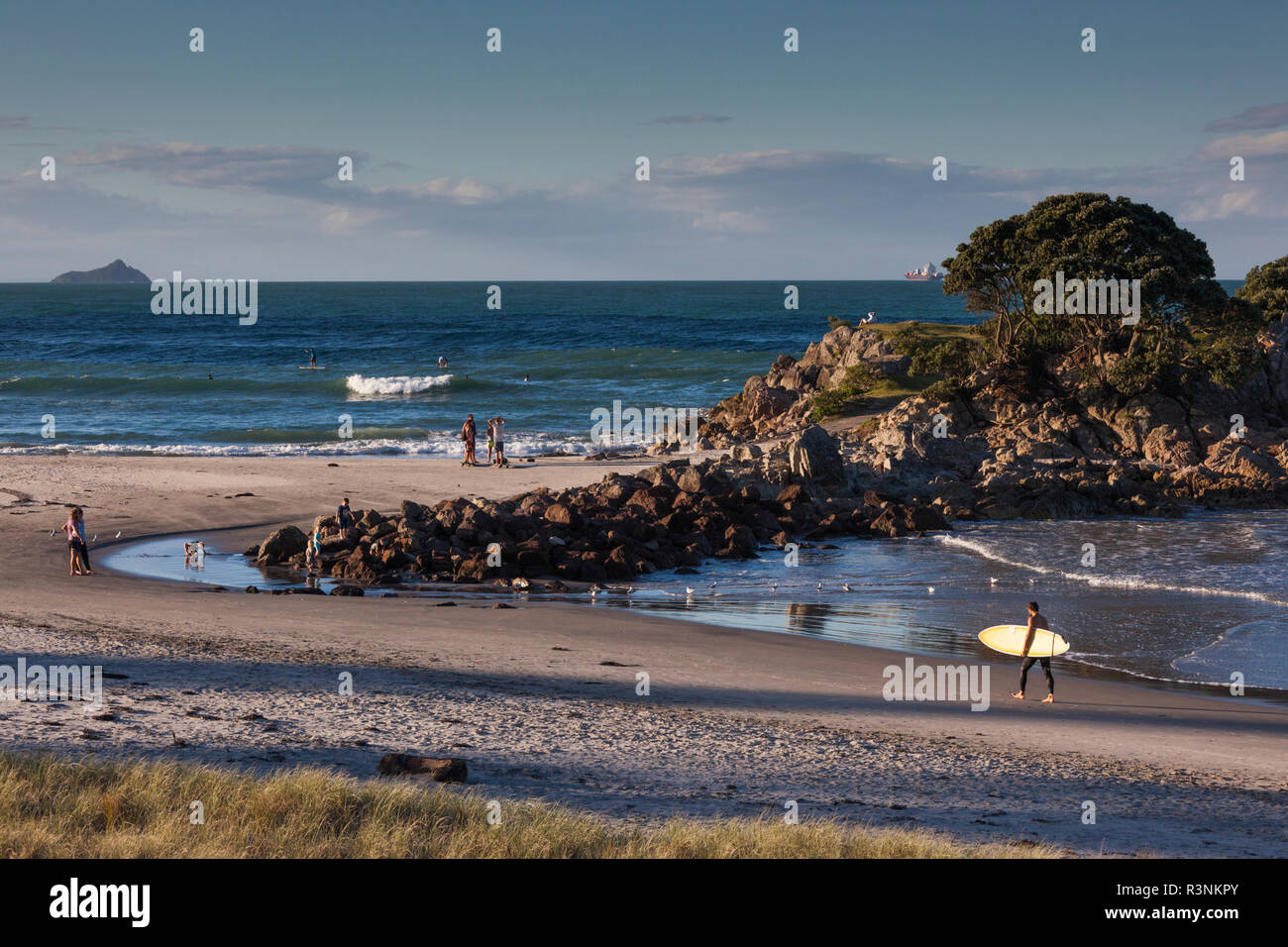 New Zealand, North Island, Mt. Manganui. The Mount Main Beach, surfers ...