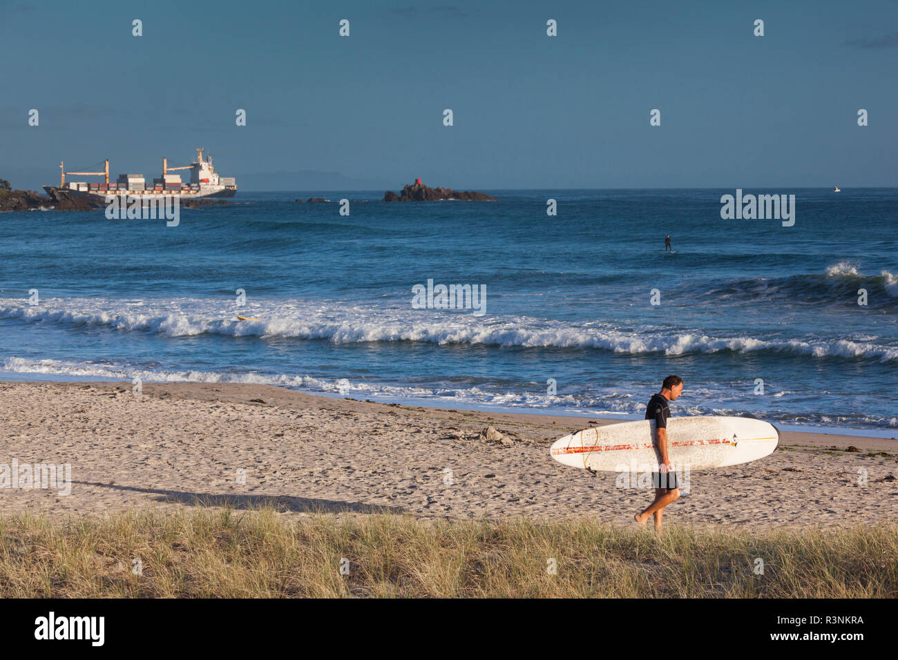 New Zealand, North Island, Mt. Manganui. The Mount Main Beach, surfers ...