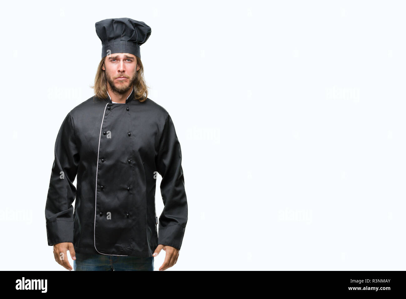 Young handsome cook man with long hair over isolated background ...