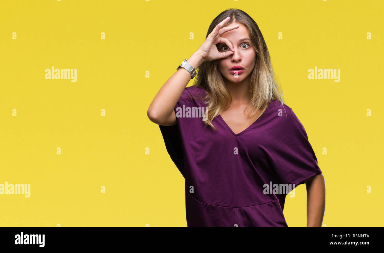 Young beautiful blonde elegant woman over isolated background doing ok ...