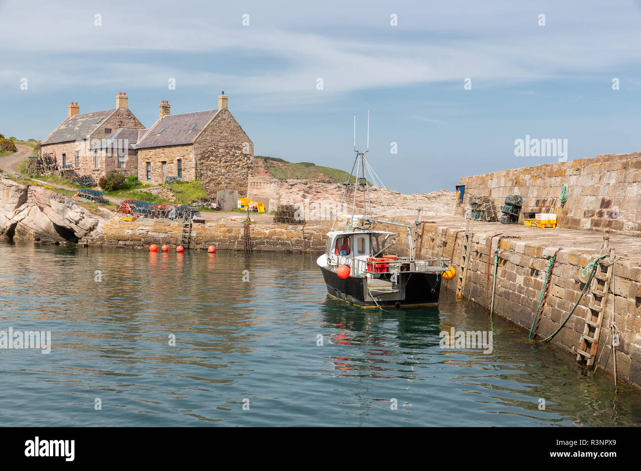 Cove harbor with fishing ship at Scottish North Sea coast Stock Photo ...
