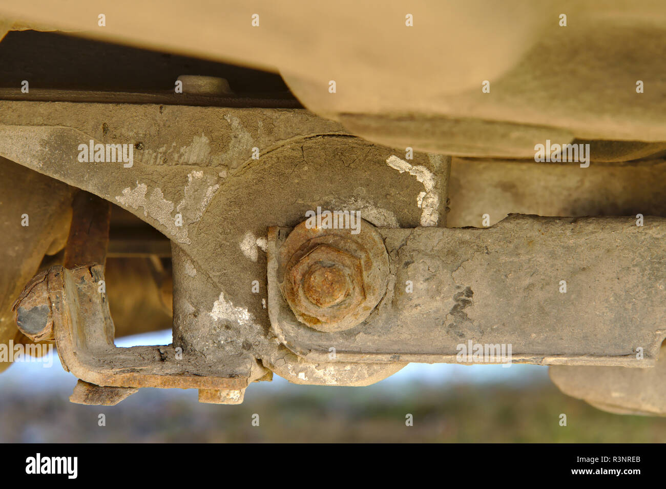Rusty mount of a rear axle of a front wheel drive car Stock Photo - Alamy