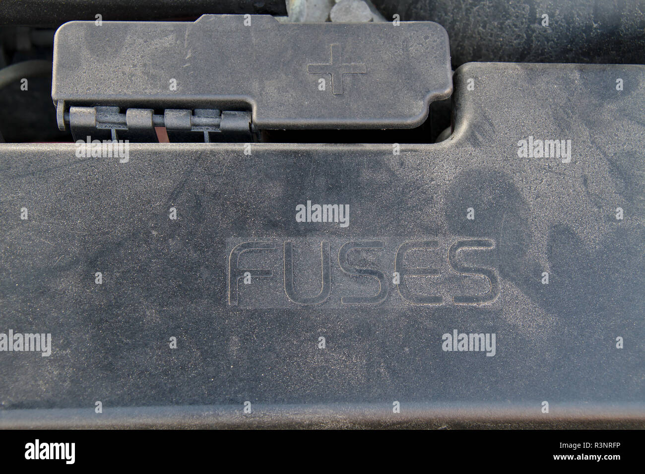 Cover of a under hood fuse box of a car. External plus terminal for ...