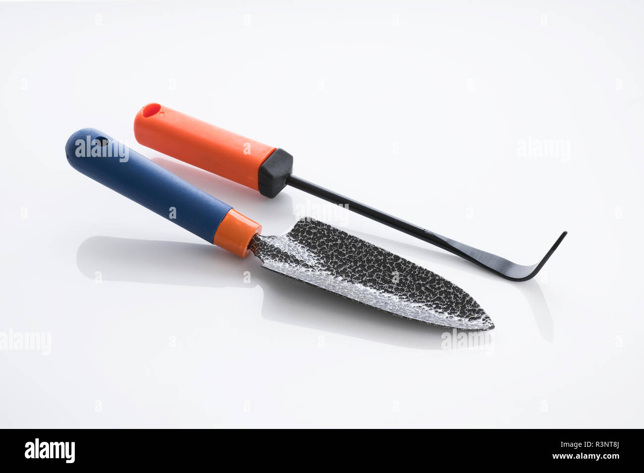 Tools: Close up of a Gardening Trowel and Cape Cod Weeder Isolated on ...
