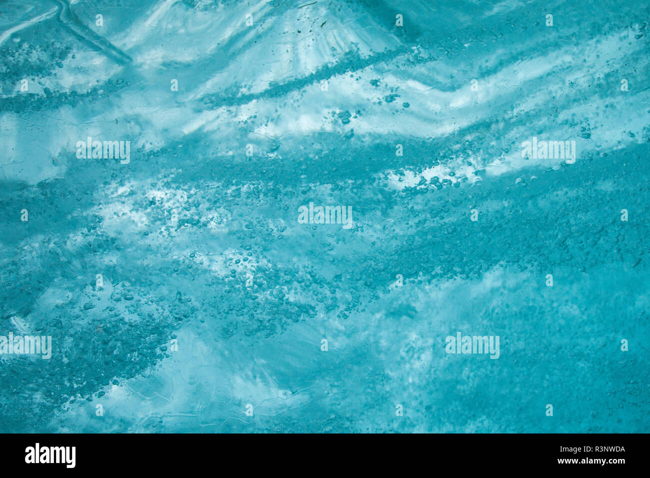Air bubbles in blue ice inside the ice tunnel at the mouth of the Rhone ...
