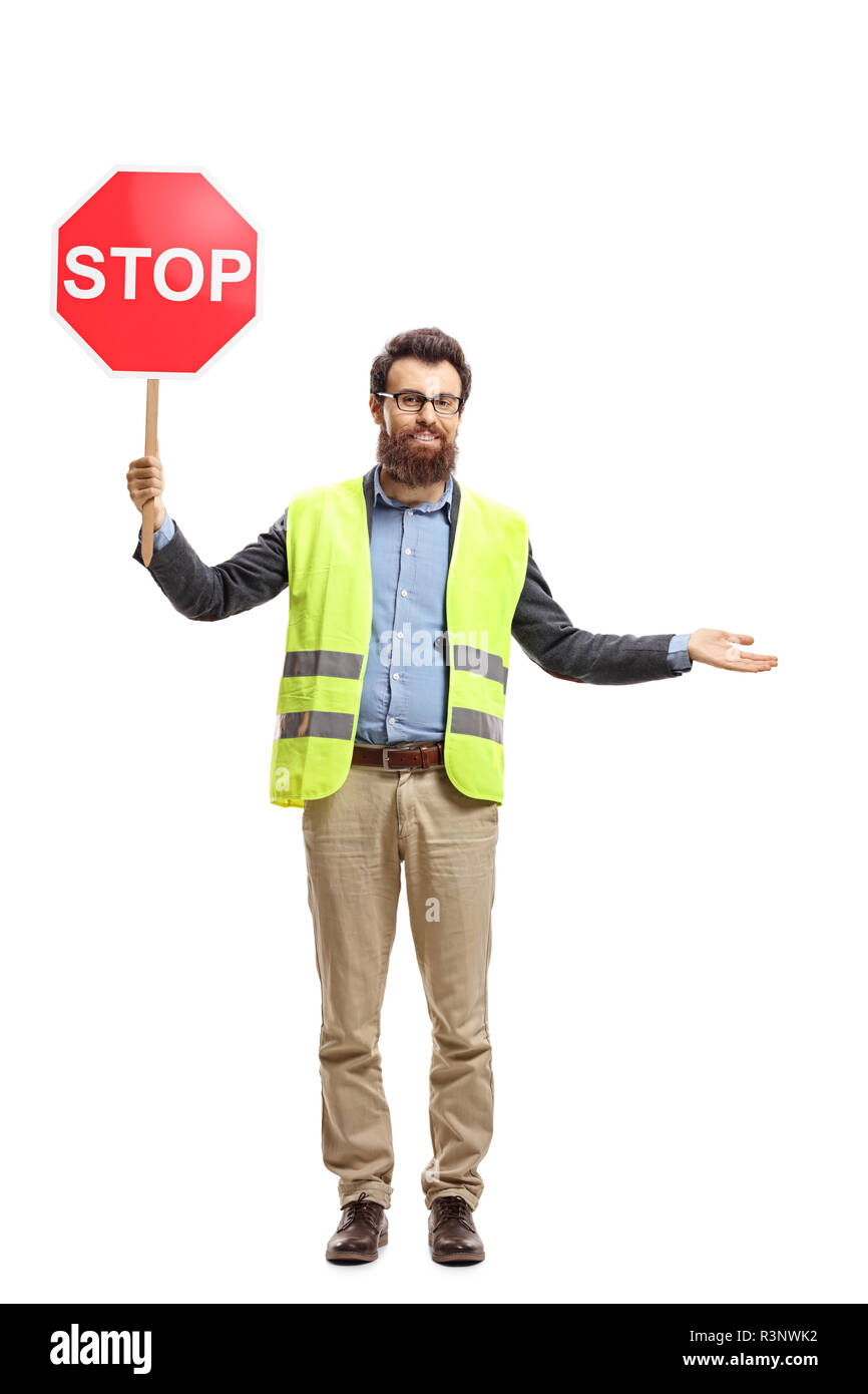Full length portrait of a man with a safety vest holding stop sign and ...