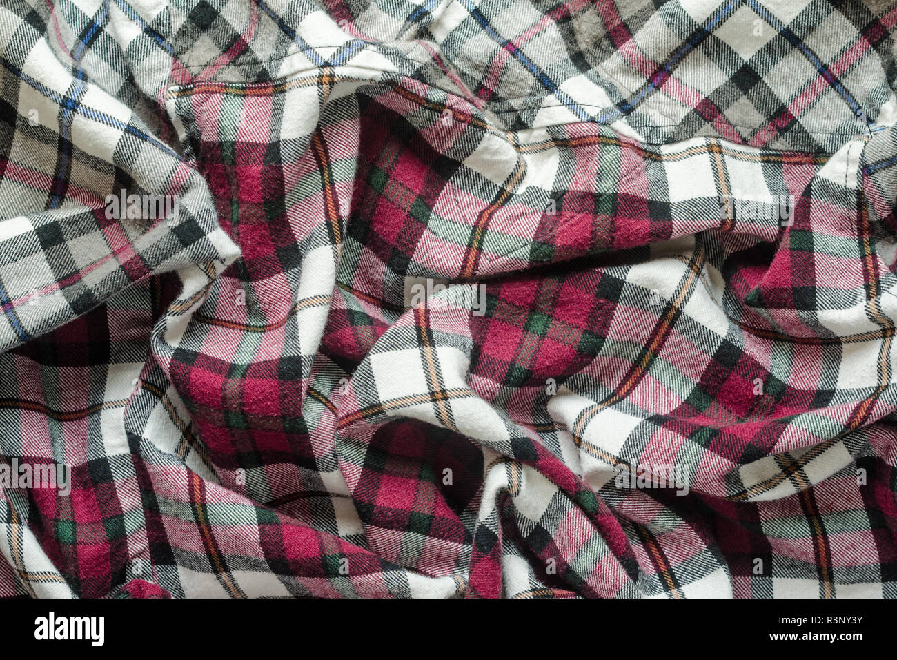 Wrinkled plaid fabric. Background crumpled cloth in a cage Stock Photo ...